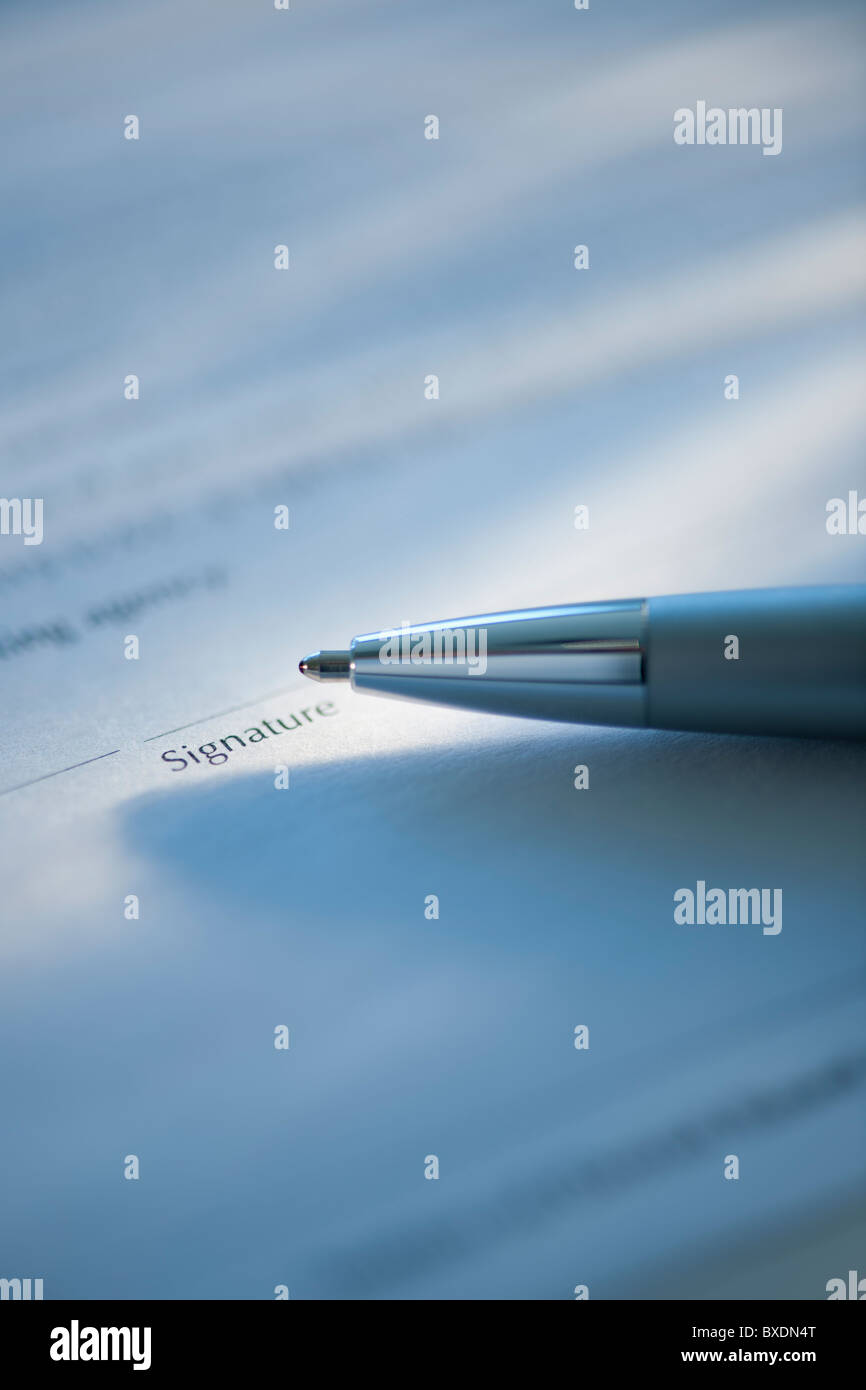Pen and signature line Stock Photo - Alamy