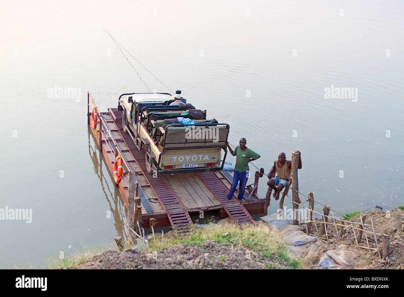 Pontoon boat used to cross Luangwa River. The boat is pulled across the ...