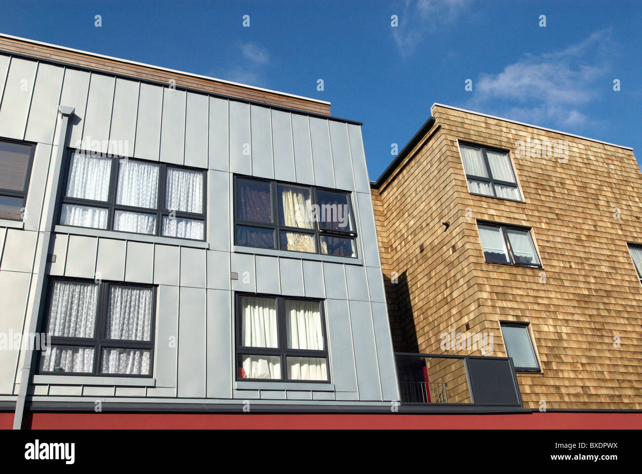 zinc sheet and cedar shingle cladding on a modern mixed-use development ...
