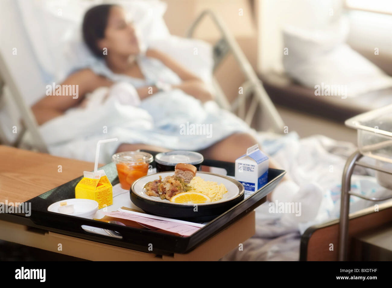 A mother in the recovery room of a hospital about to have her breakfast ...