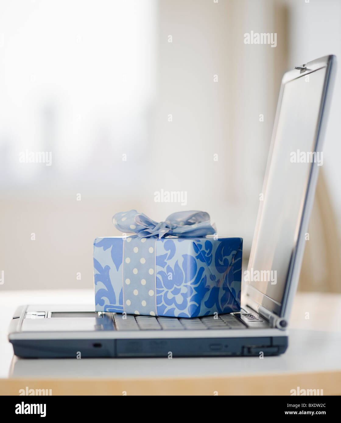 Gift on laptop Stock Photo - Alamy