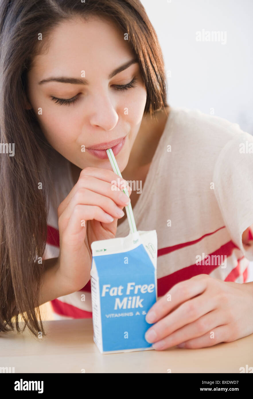 Woman drinking milk Stock Photo - Alamy