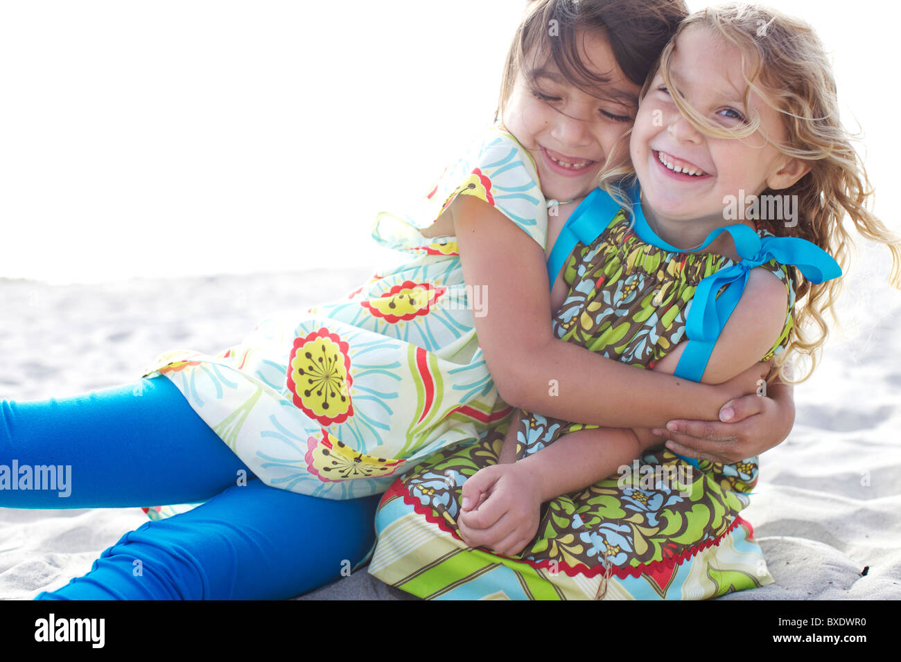 Children hugging on beach Stock Photo - Alamy