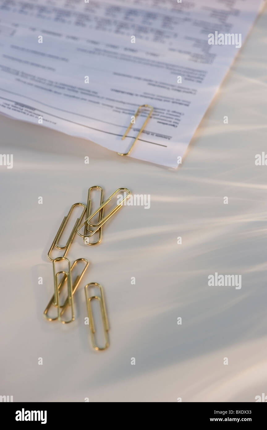 Paper clips and document Stock Photo - Alamy