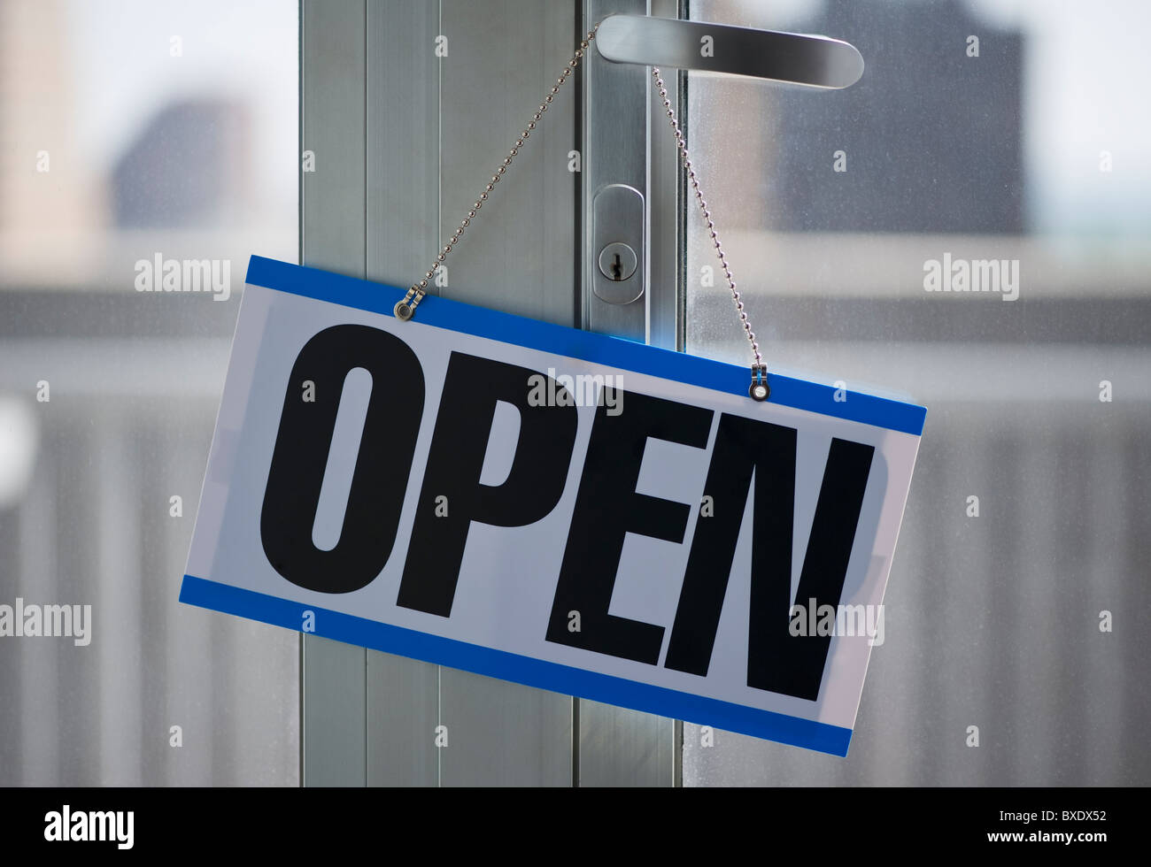 Open sign hanging on door Stock Photo - Alamy