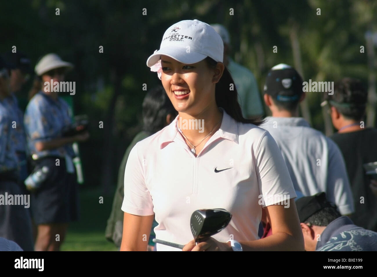 15 year old Michelle Wie smiles after a tee shot during a practice ...