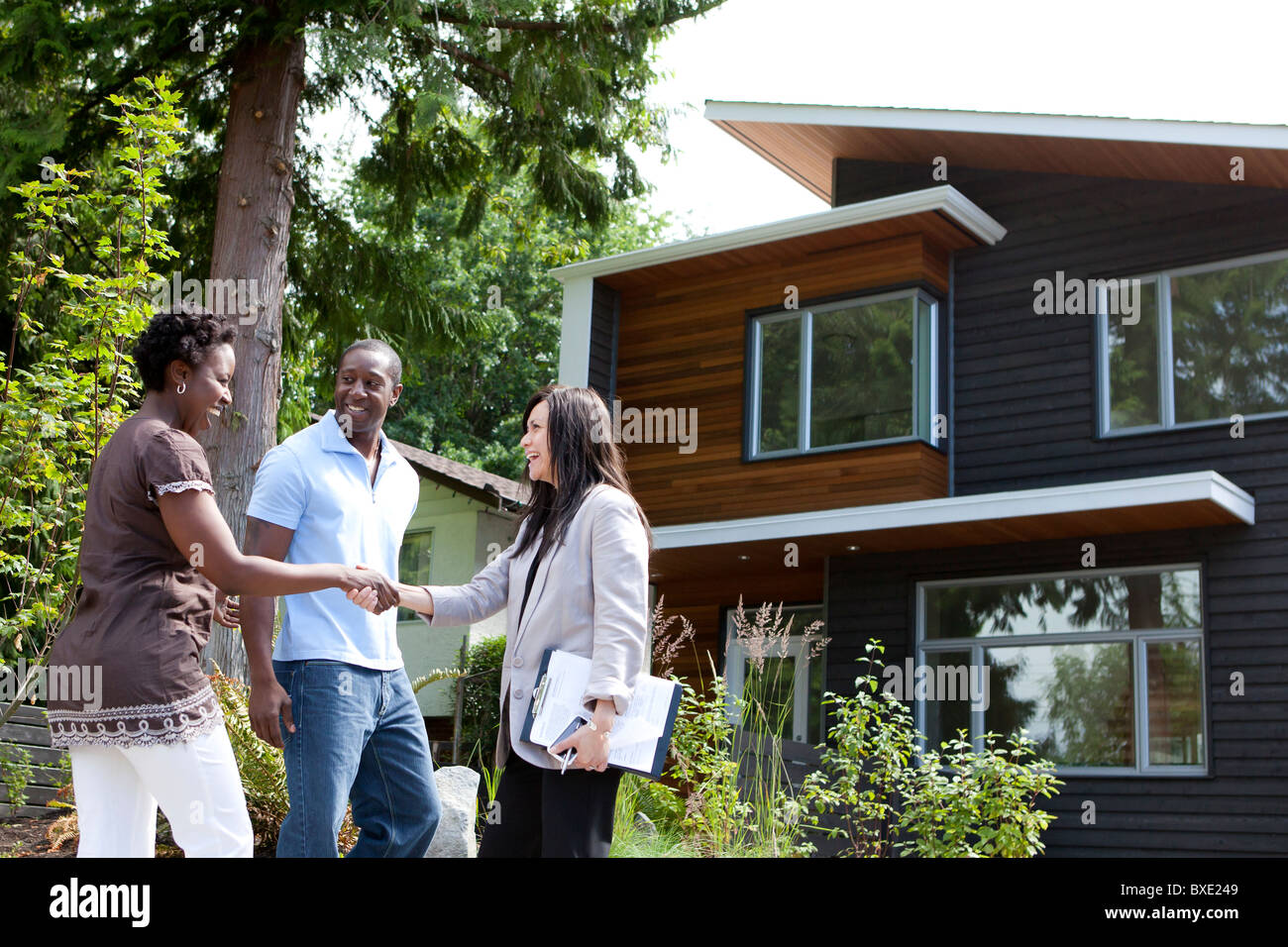 Real estate agent couple welcoming hi-res stock photography and images ...