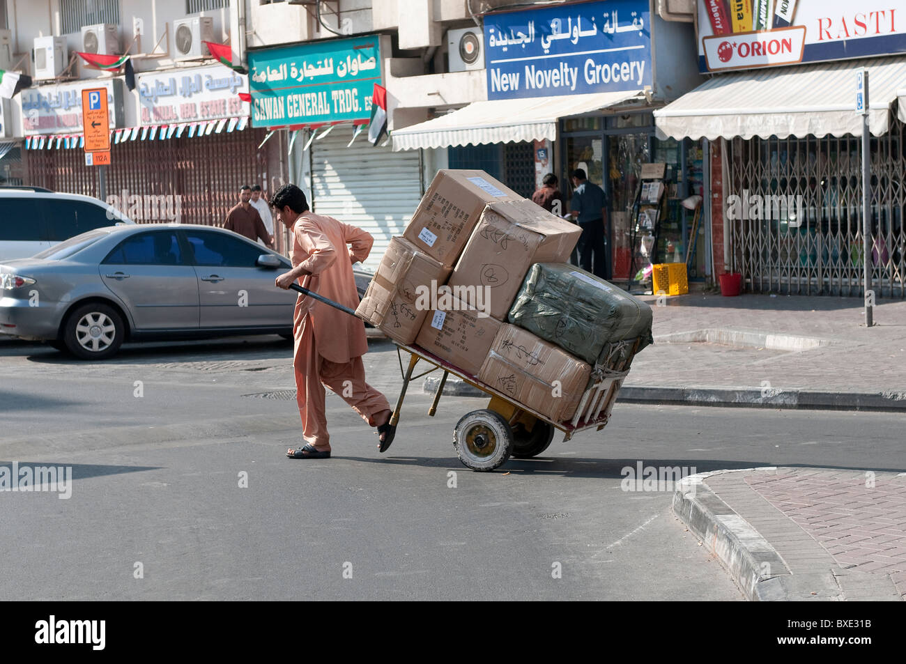 porter worker in Dubai Stock Photo - Alamy