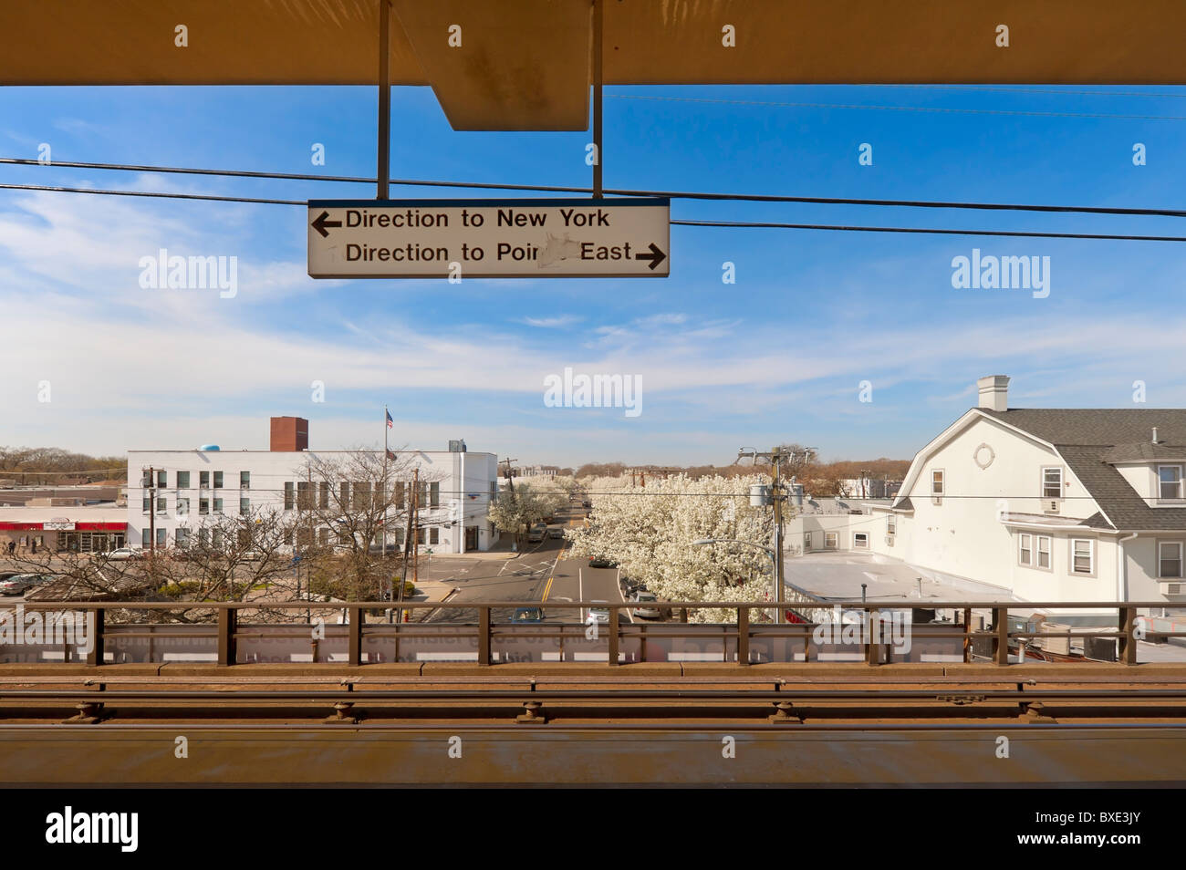 View from Long Island Railroad elevated platform, with sign: Directions ...