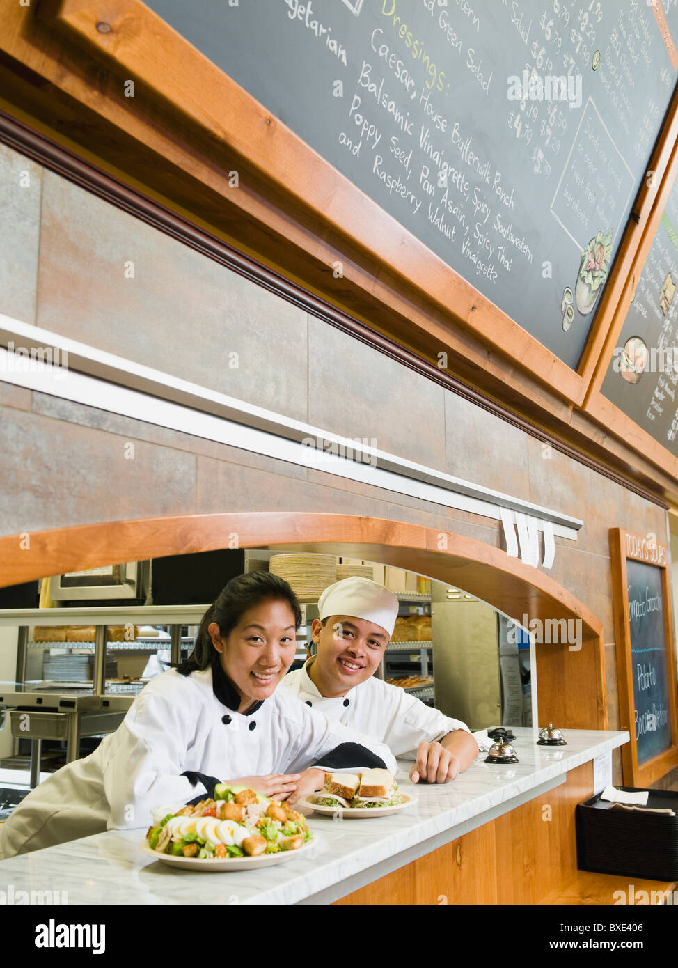 Chefs in restaurant Stock Photo - Alamy