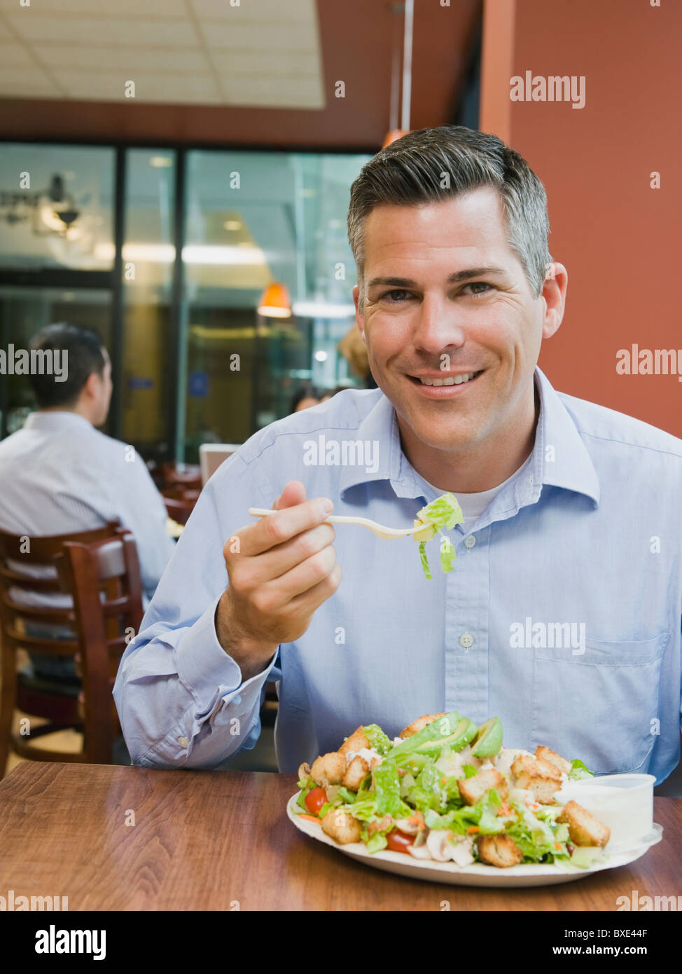 Man in restaurant facing camera hi-res stock photography and images - Alamy