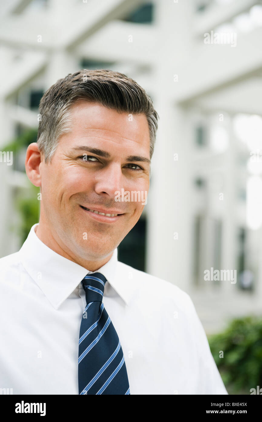 Smiling businessman facing camera hi-res stock photography and images ...