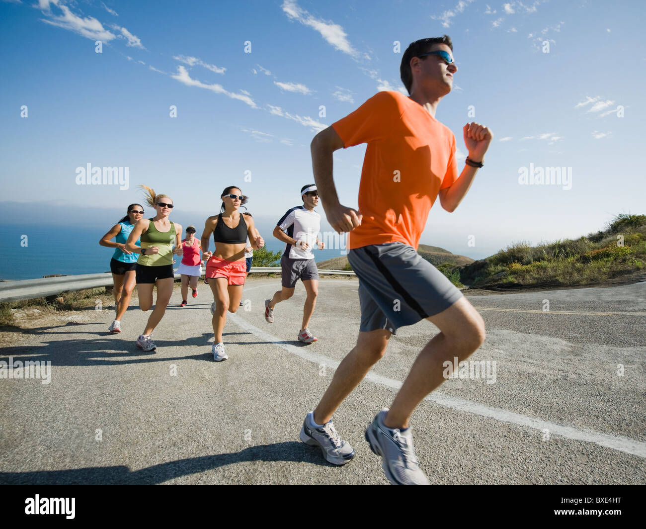 Runners on a road in Malibu Stock Photo - Alamy