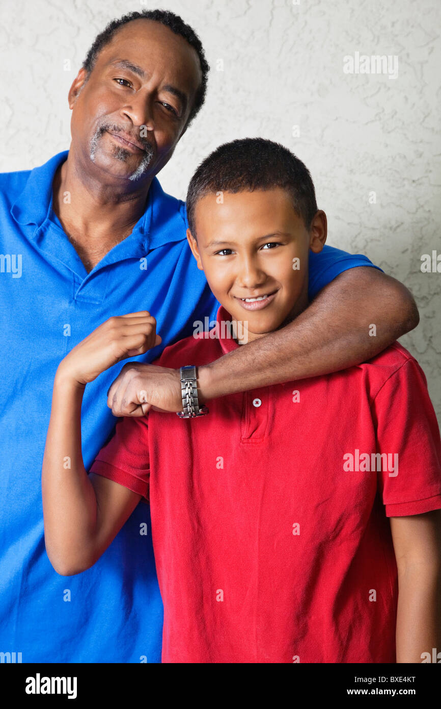Black father hugging son Stock Photo - Alamy