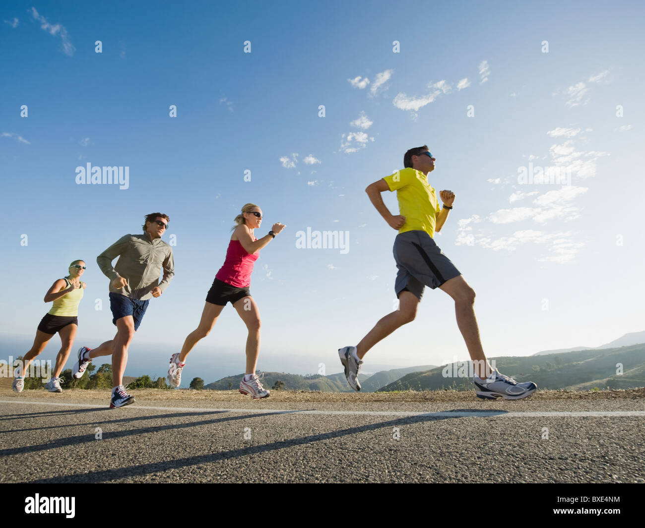 Runners on a road in Malibu Stock Photo - Alamy