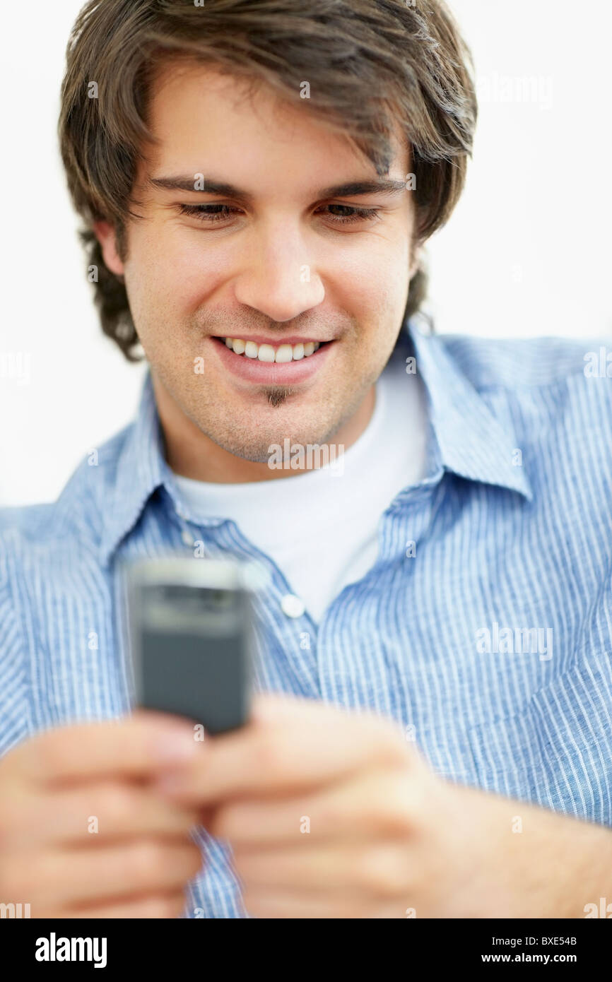 Handsome man texting Stock Photo - Alamy
