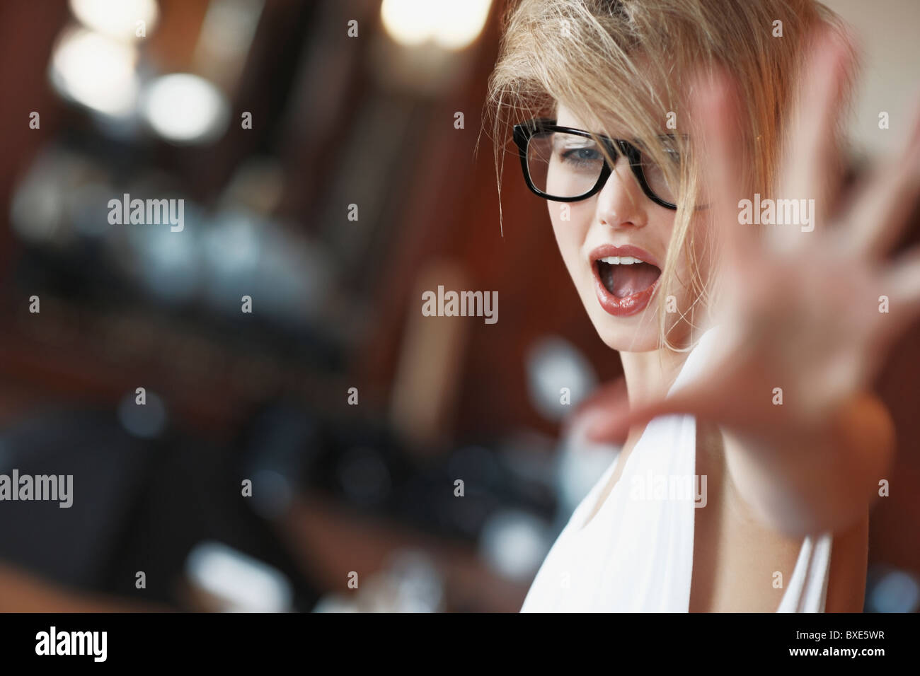 Blond woman shouting Stock Photo - Alamy