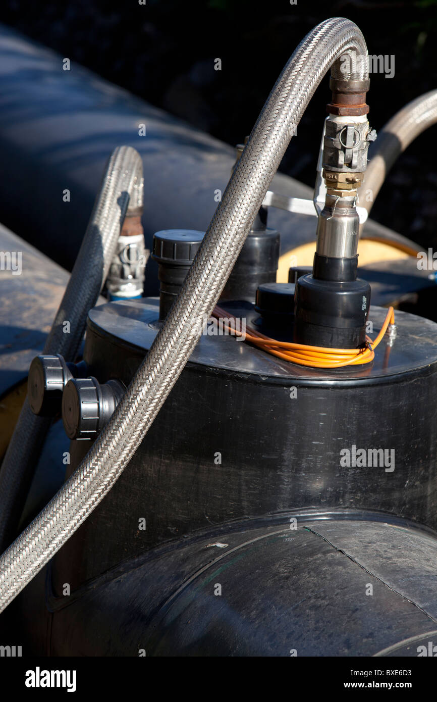 Metal enforced high pressure and high temperature hose attached to a ...