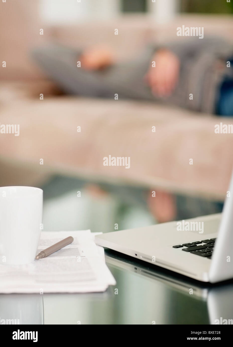 Paperwork and laptop on desk Stock Photo - Alamy