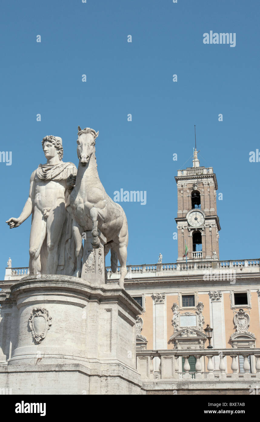 One of the two Dioscuri in Piazza del Campidoglio in Rome, and tower of ...
