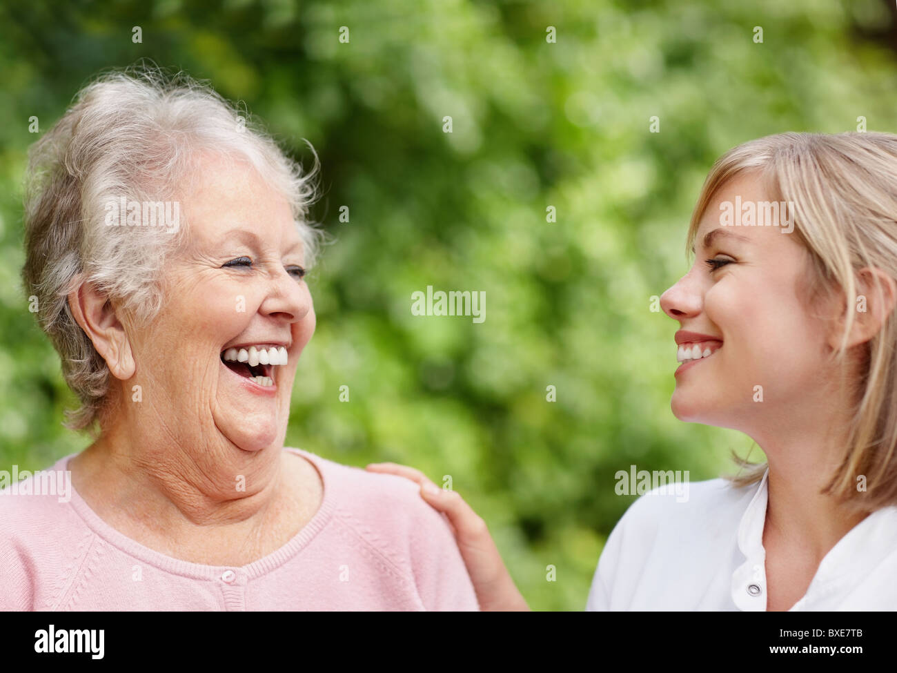 Two women laughing Stock Photo - Alamy
