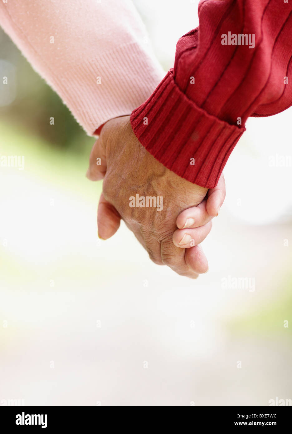 two people holding hands Stock Photo - Alamy