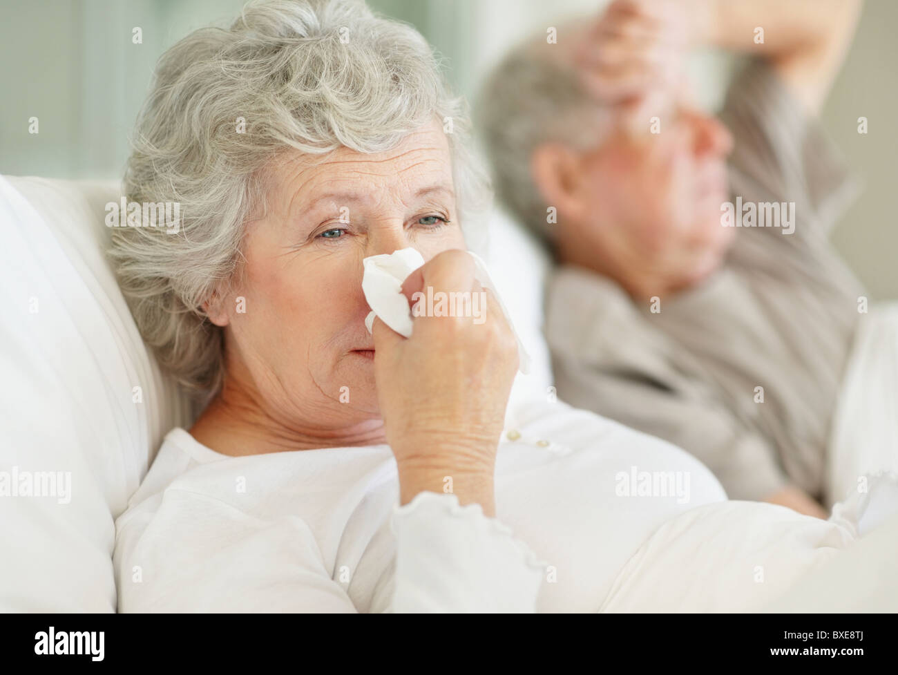Senior couple in bed with the flu Stock Photo - Alamy