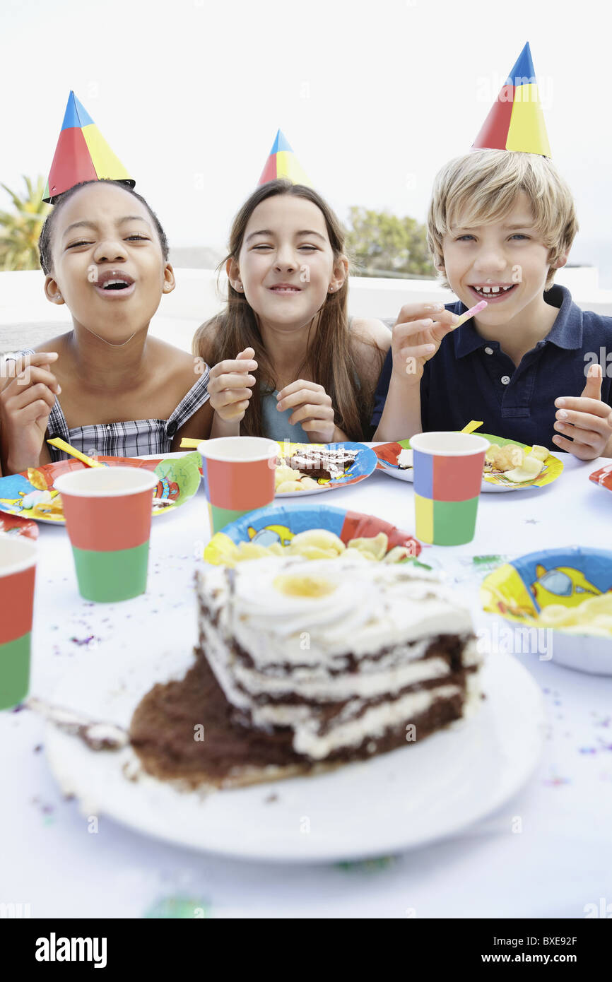 Children eating birthday cake Stock Photo - Alamy