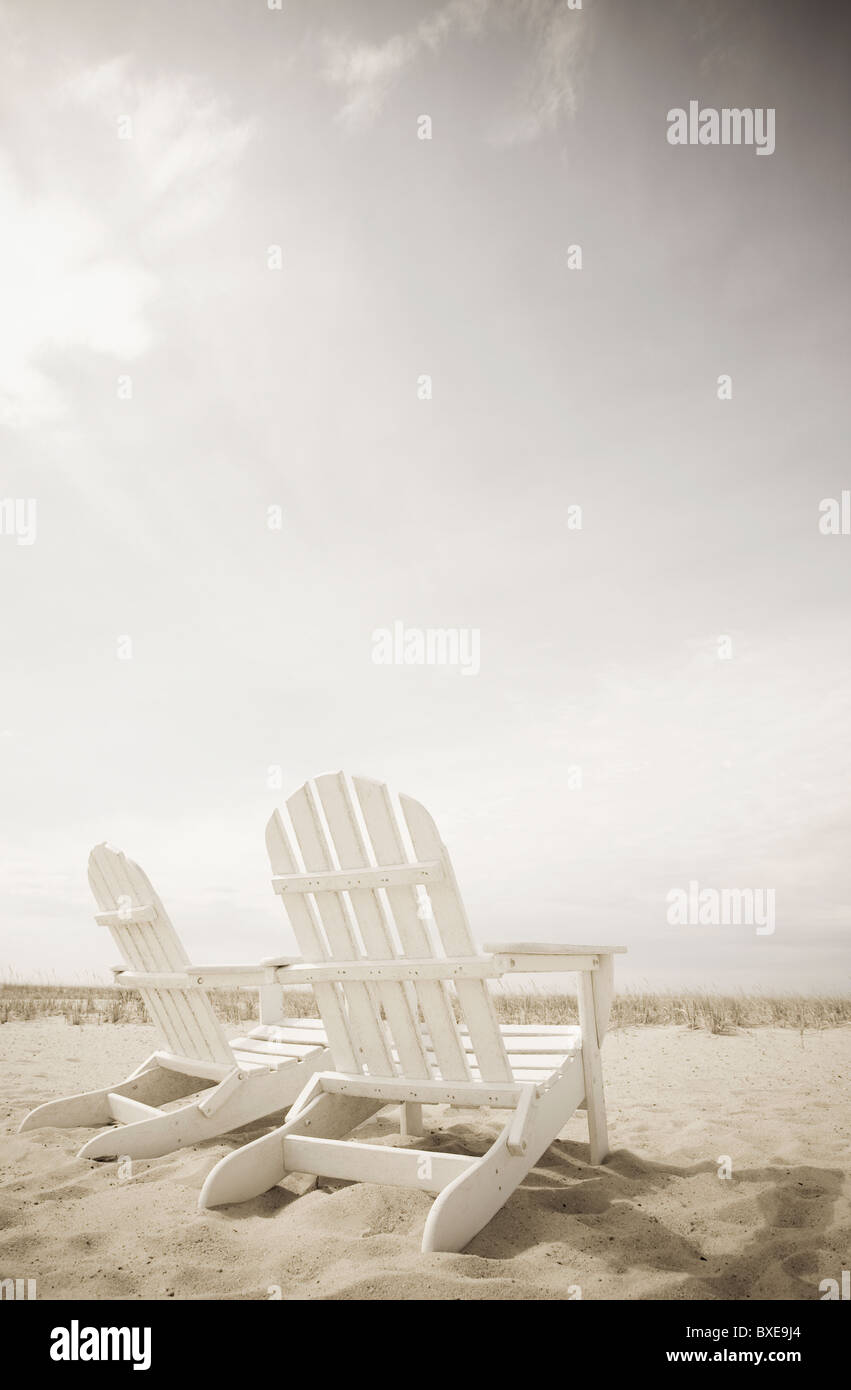 Adirondack chairs on the beach Stock Photo - Alamy