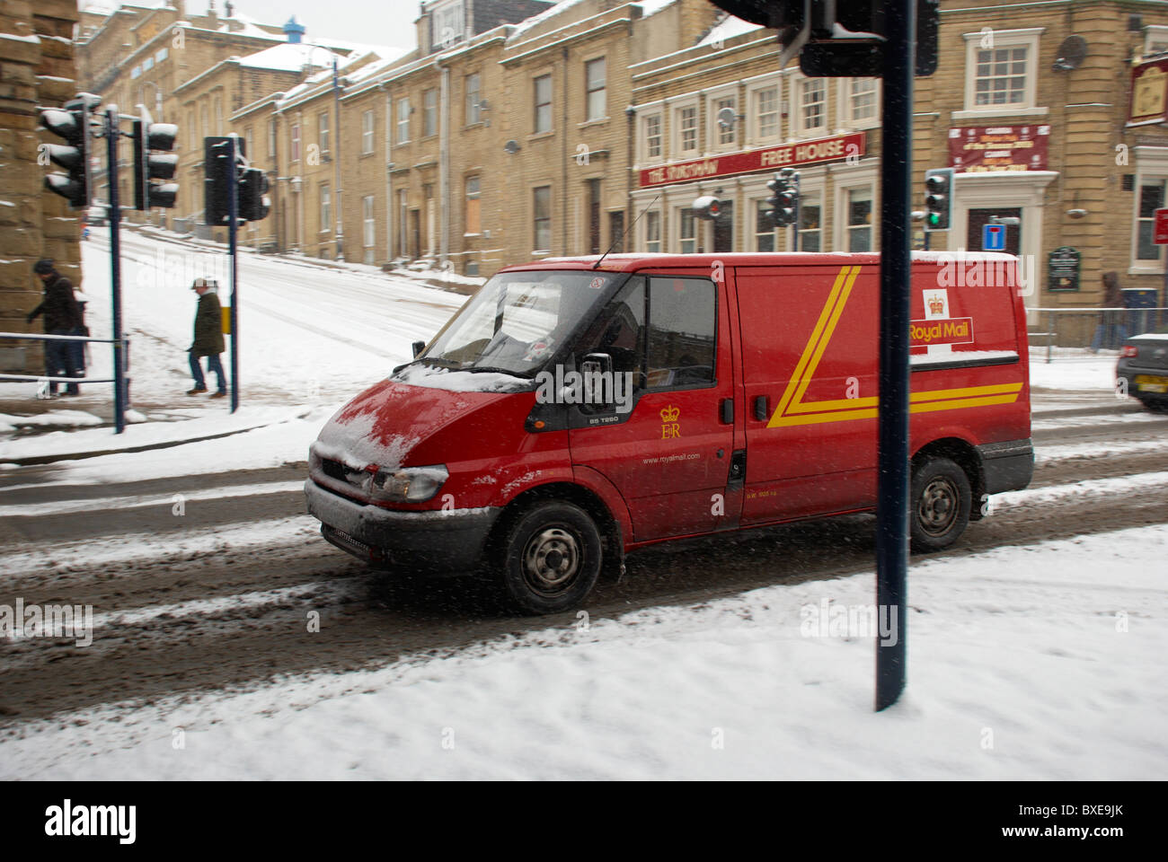 royal mail delivery van driving through the snow Stock Photo - Alamy