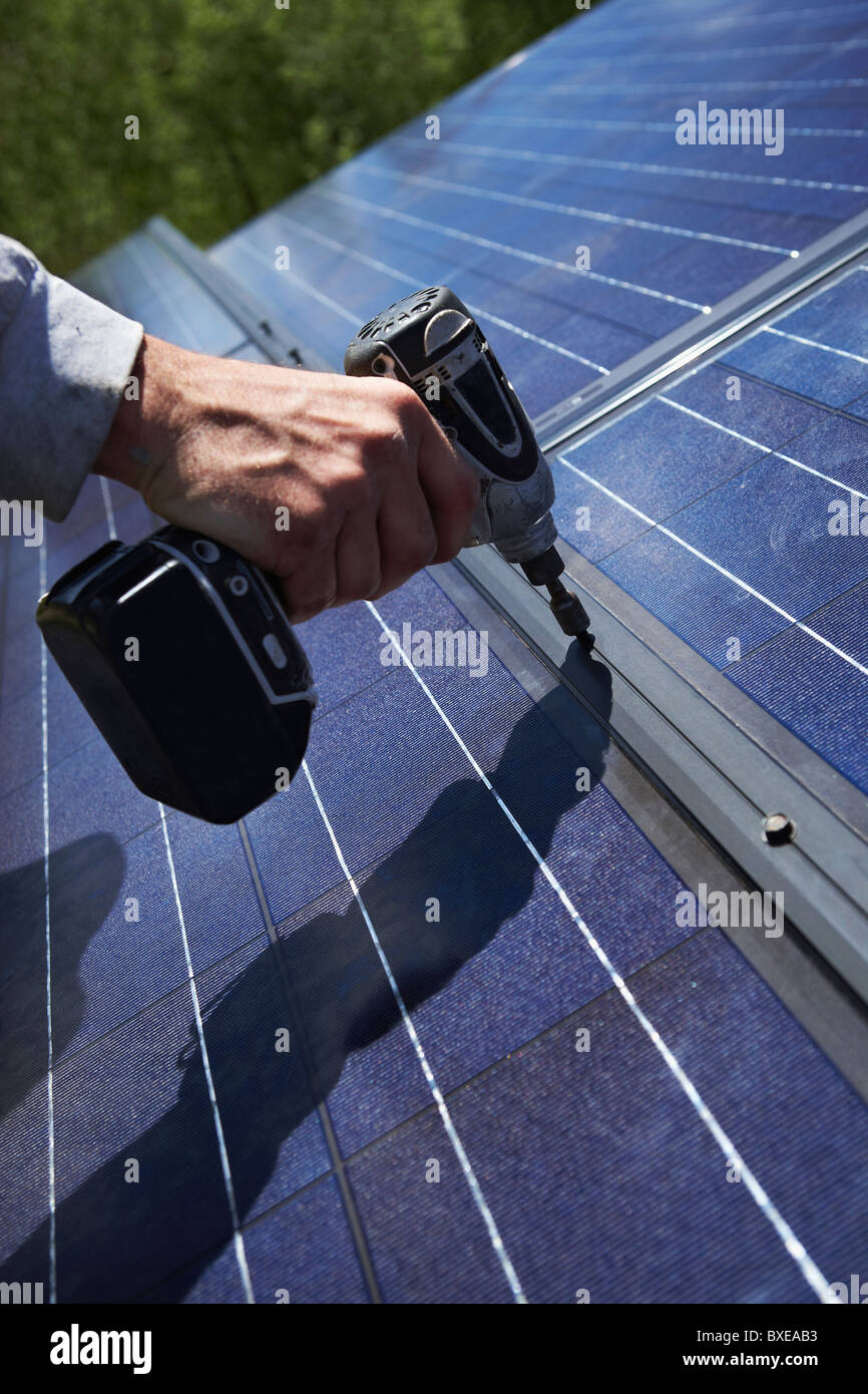 Group of people installing solar panels hi-res stock photography and ...
