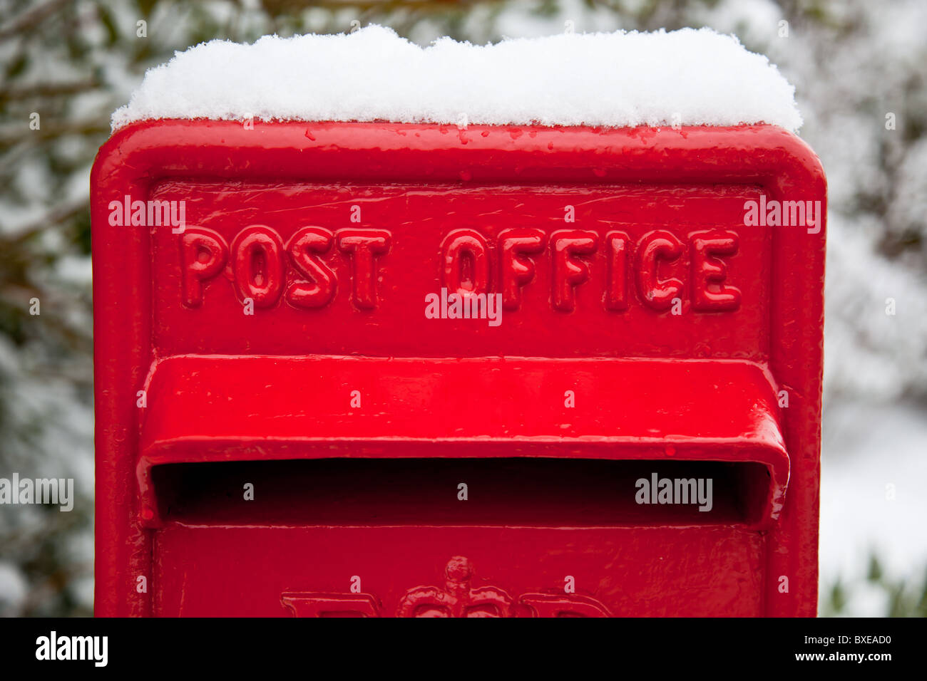 Snow topped Royal Mail post box Stock Photo - Alamy