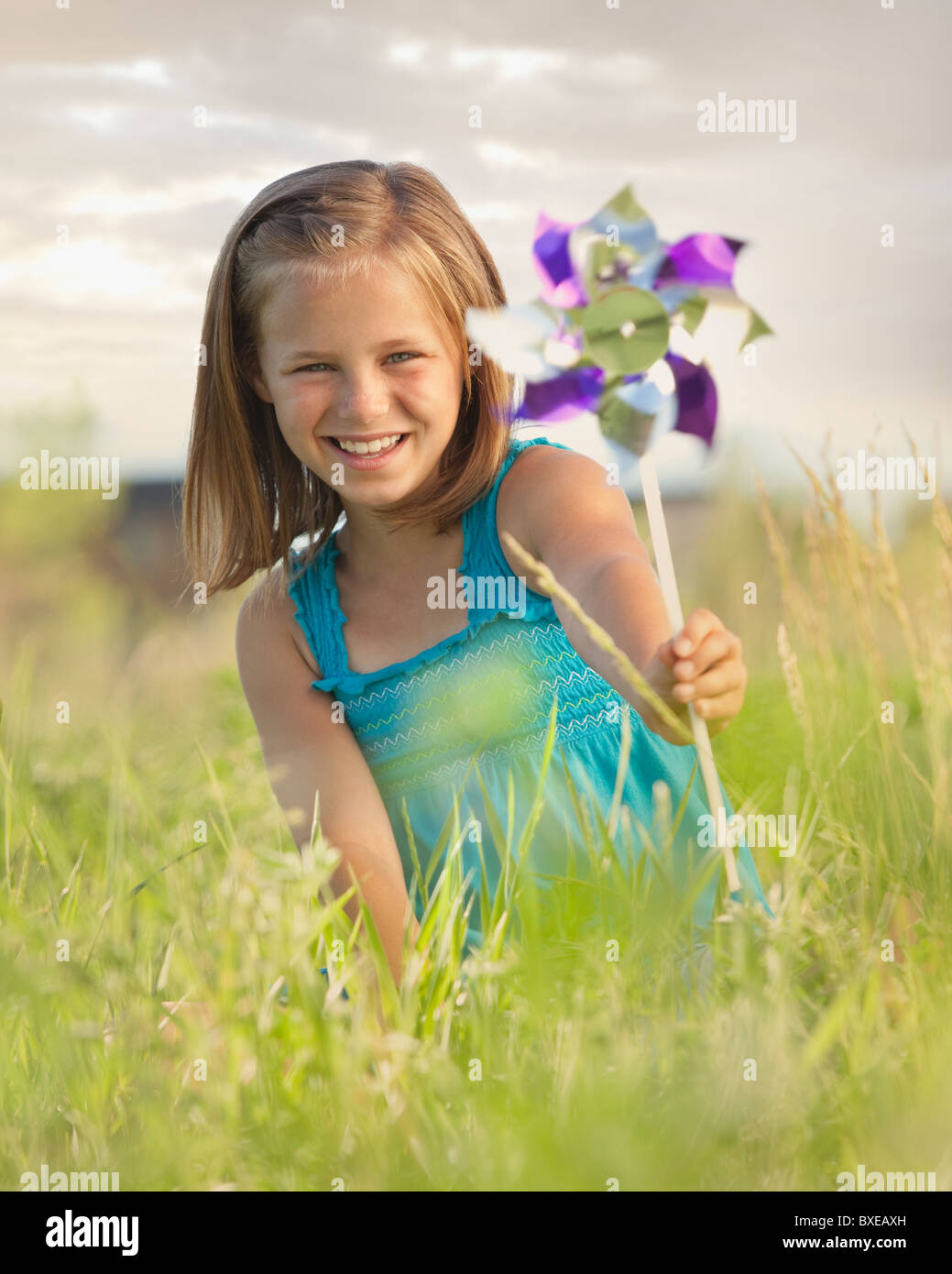Girl with a pinwheel hi-res stock photography and images - Alamy