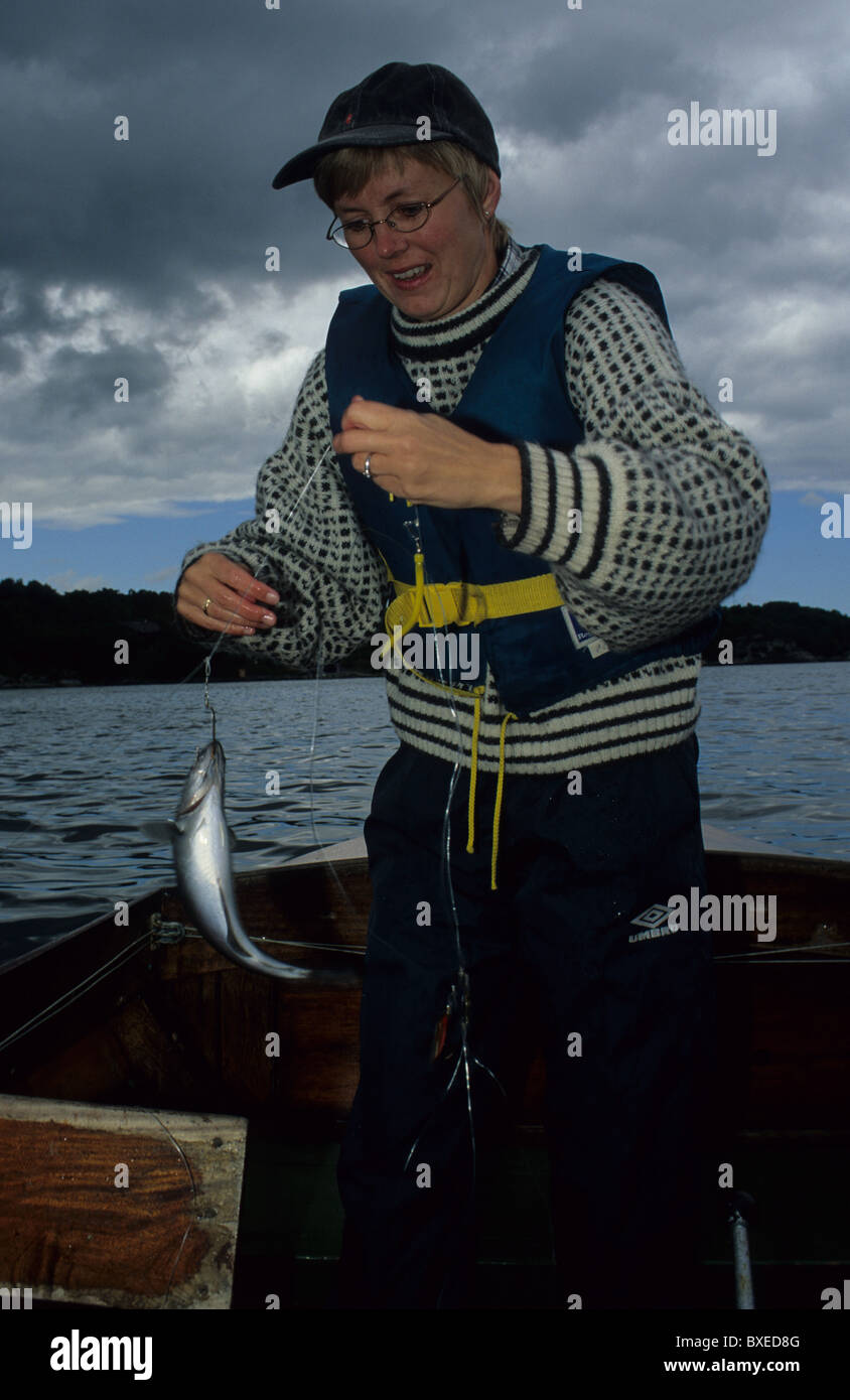 Women fishing from boat, fish, cod, mackerel, Women with fish from the ...
