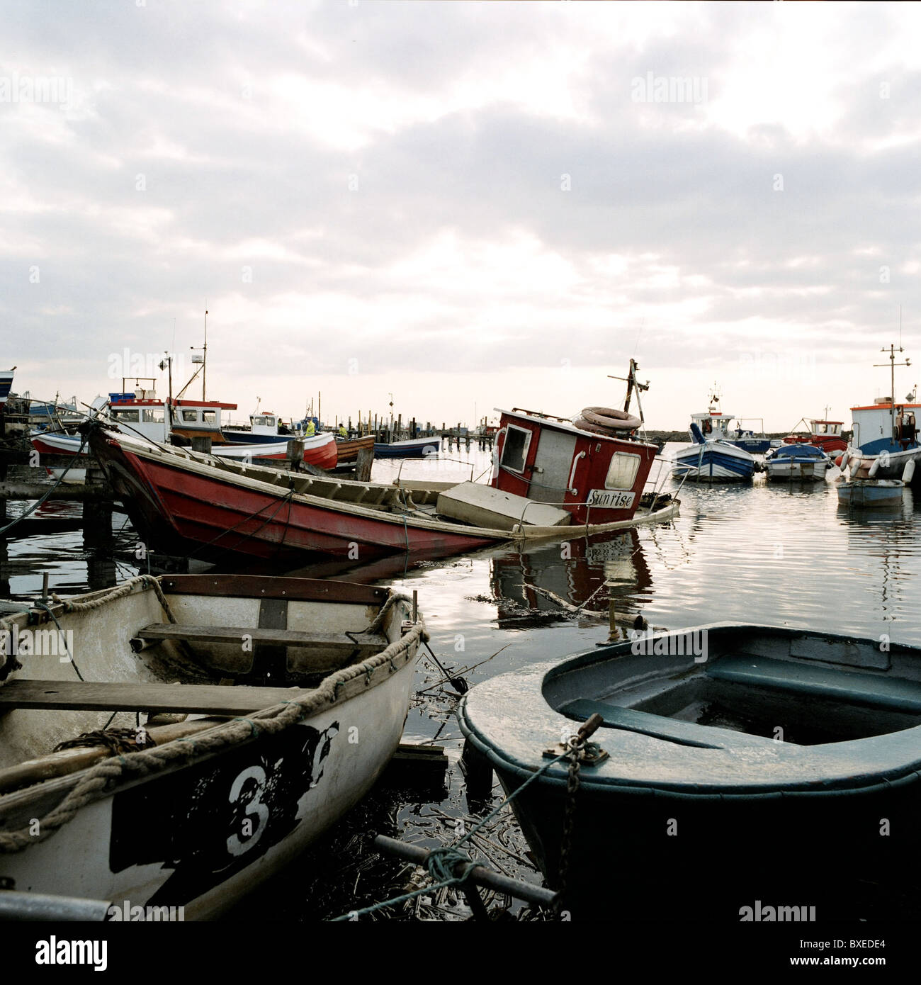 Fishing boats docked at high tide in Paddy's Hole harbour, near Redcar ...