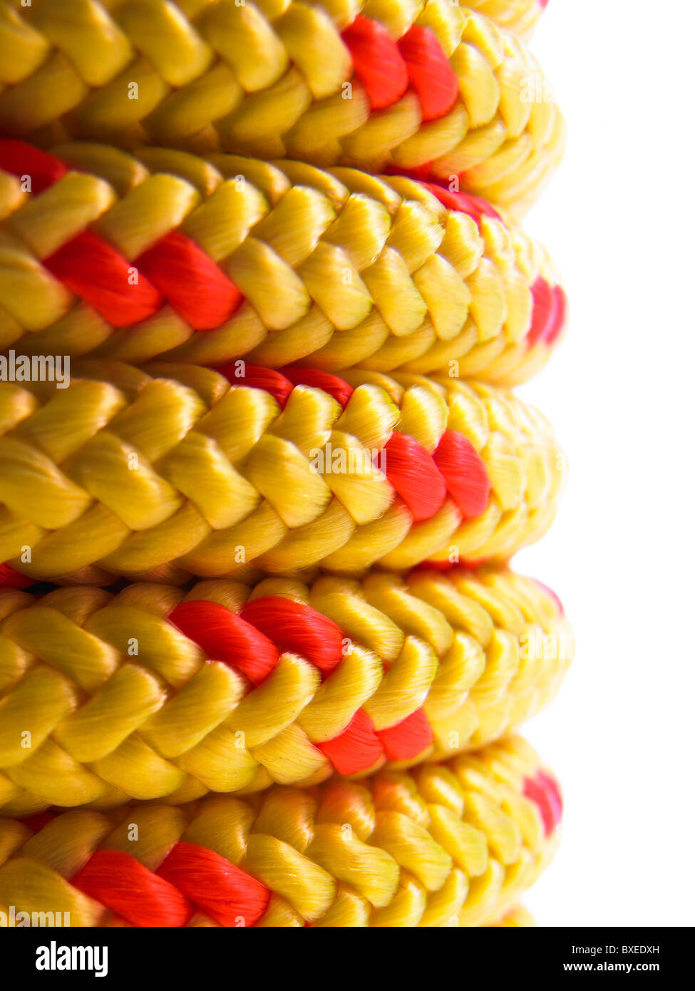 Stack of yellow rope Stock Photo - Alamy