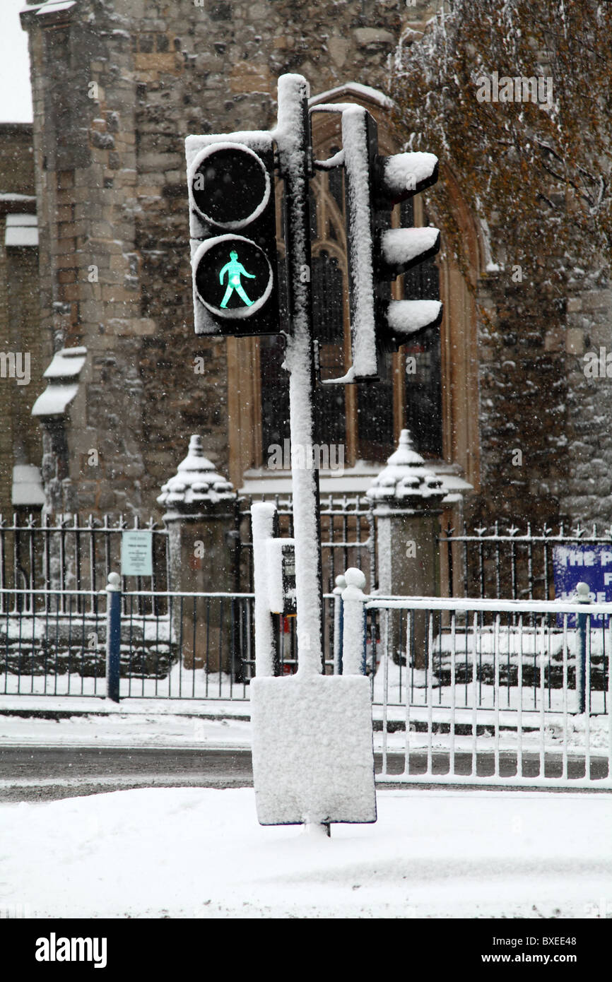 A traffic light covered in snow. Putney High Street. London Stock Photo ...