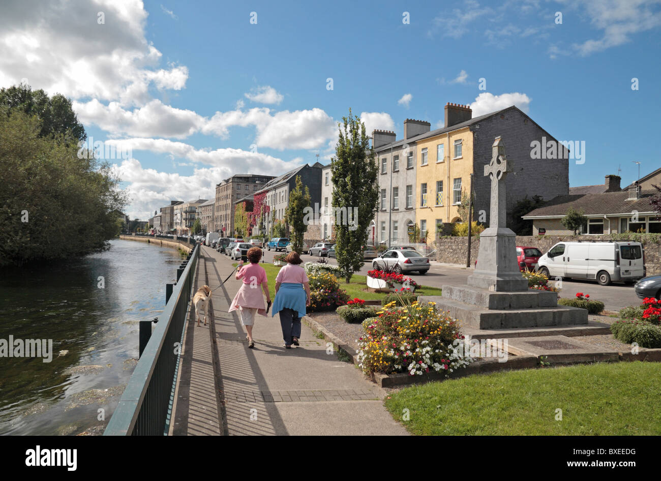 Pedestrians walking along New Quay, beside the River Suir, Clonmel ...