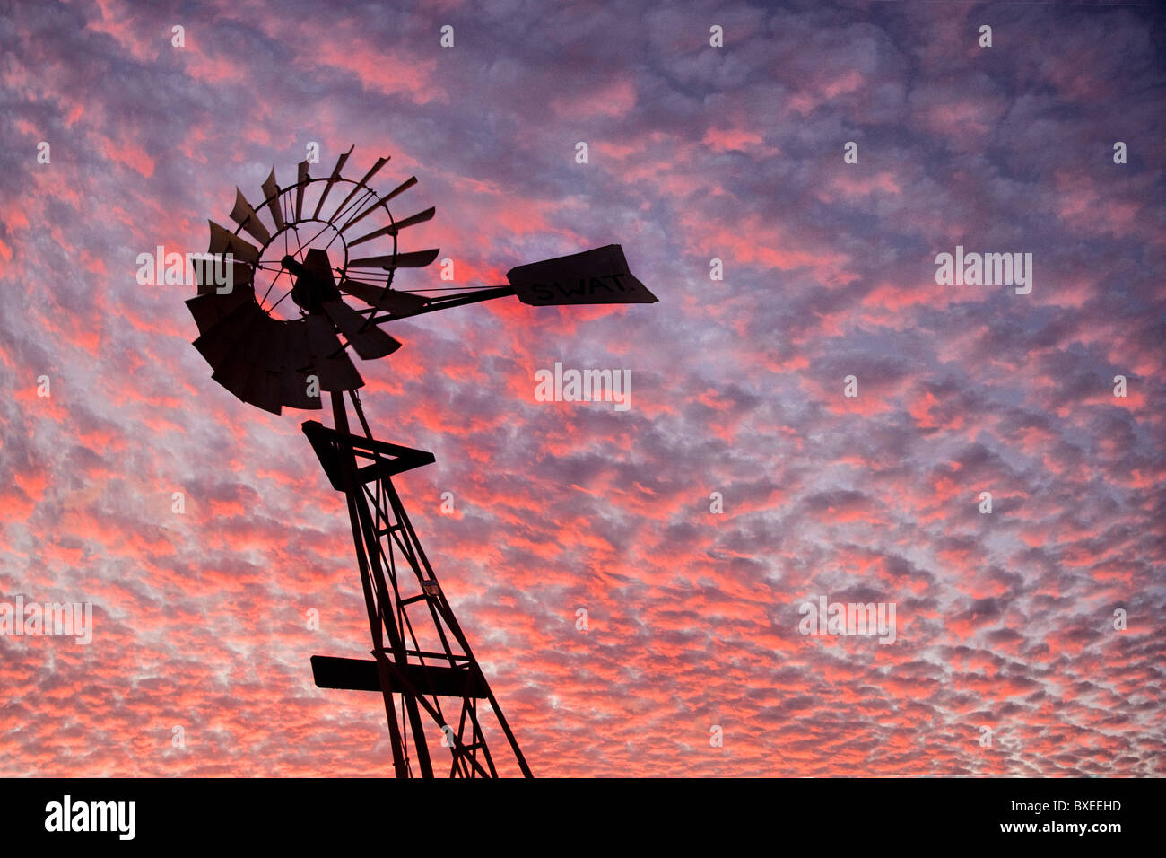 Wind pump and Western Australian sunset Stock Photo - Alamy