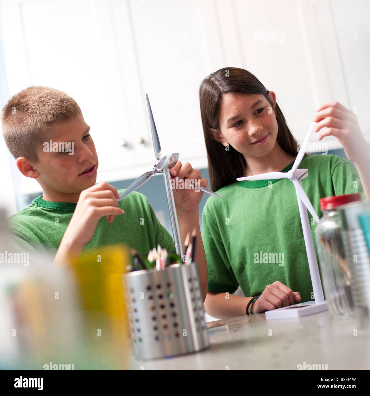 Two children making model windmills Stock Photo - Alamy