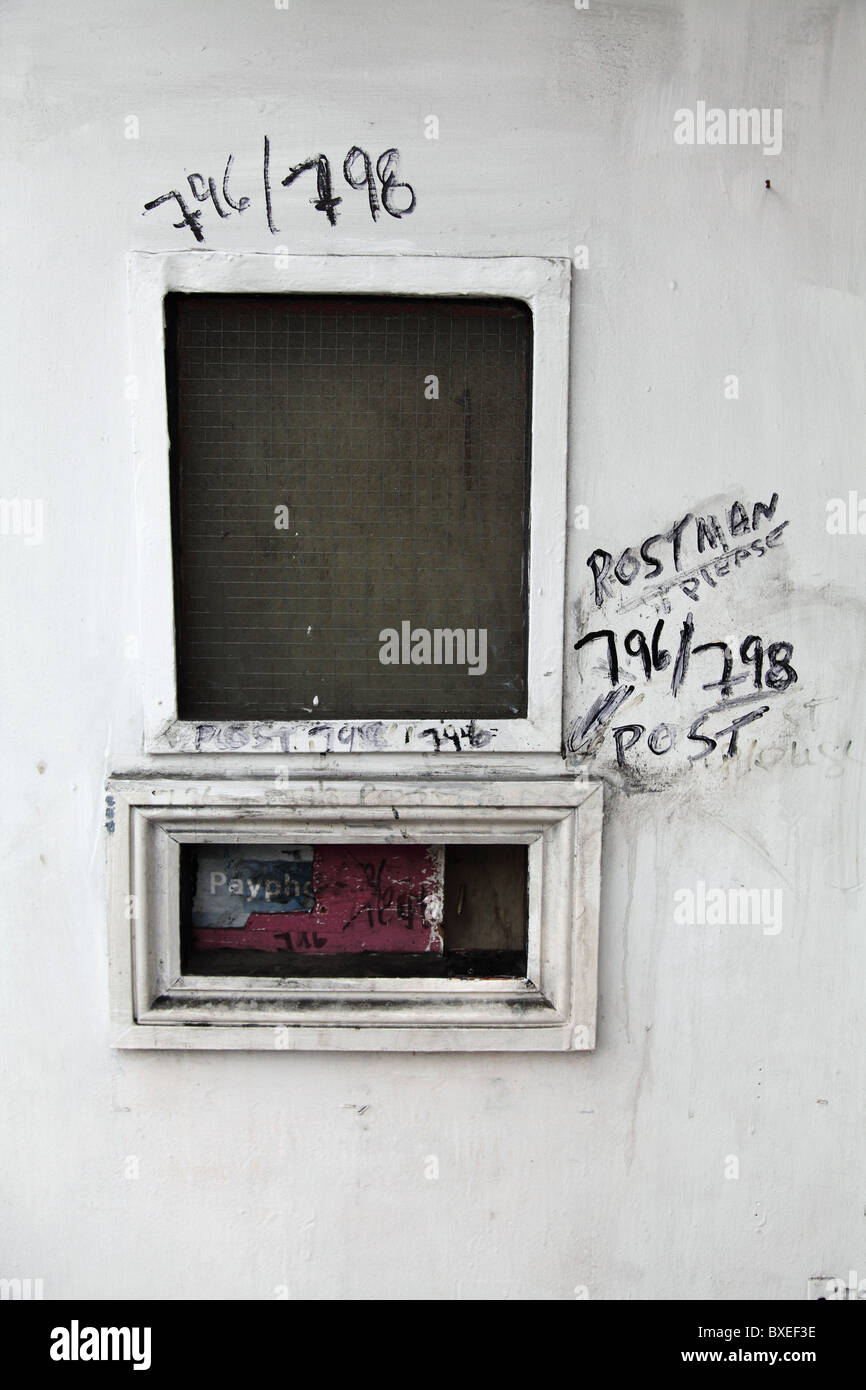 Letter box with a note for the postman. London Stock Photo - Alamy