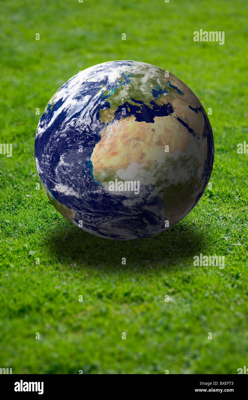 Globe on lawn Stock Photo - Alamy