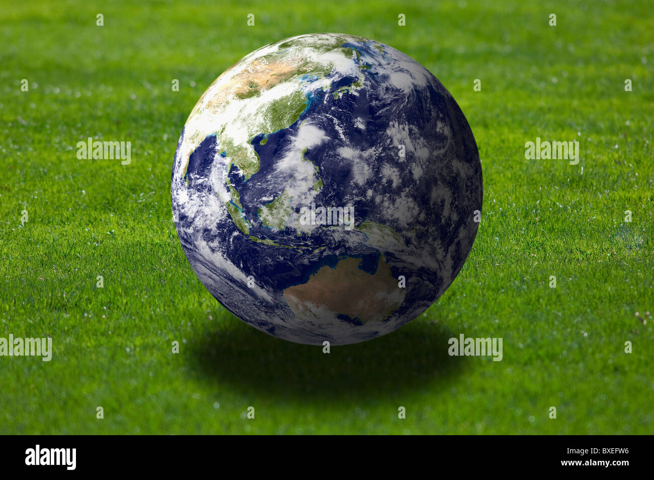 Globe on lawn Stock Photo - Alamy