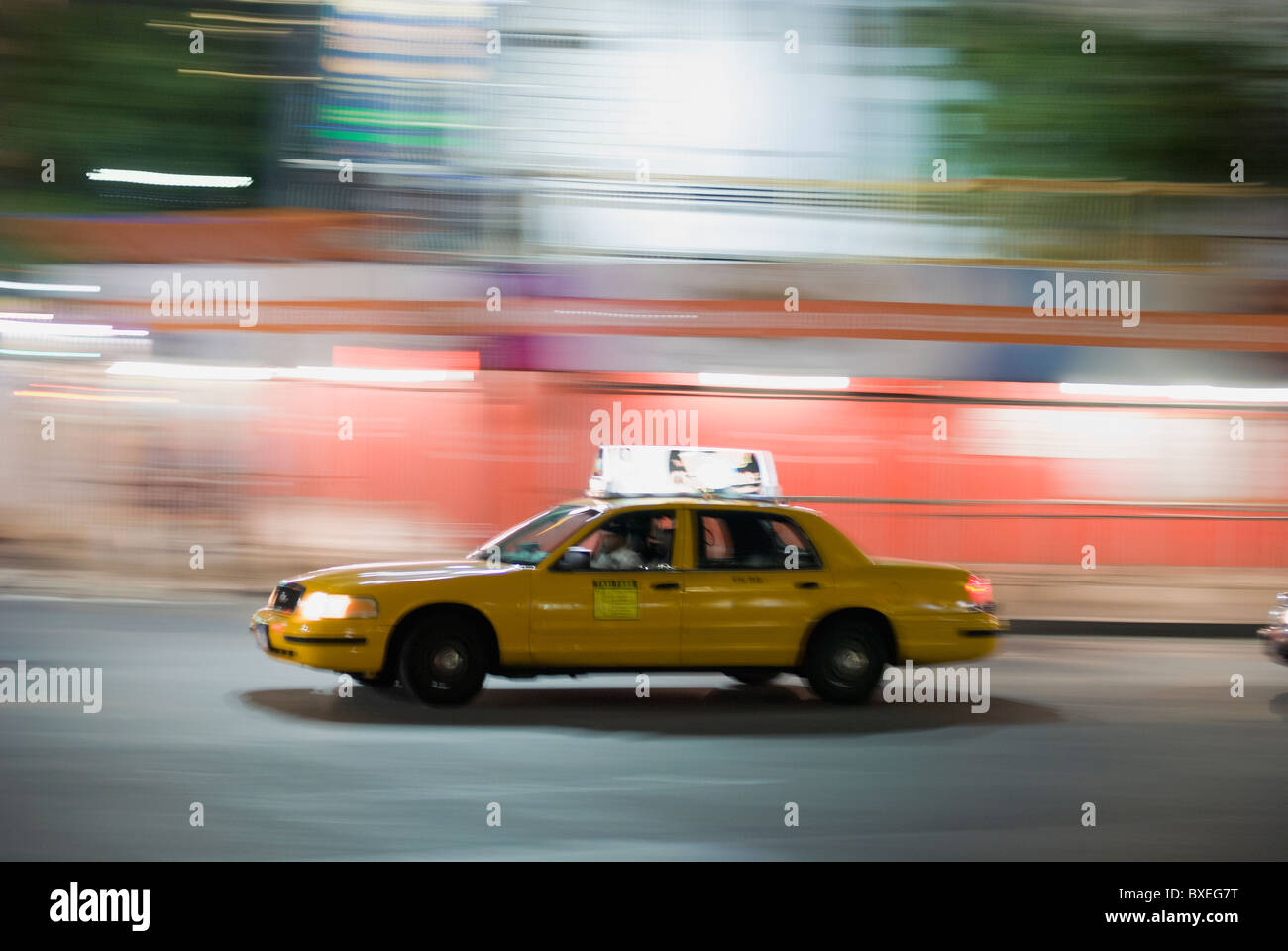 Taxi cab driving at night Stock Photo - Alamy