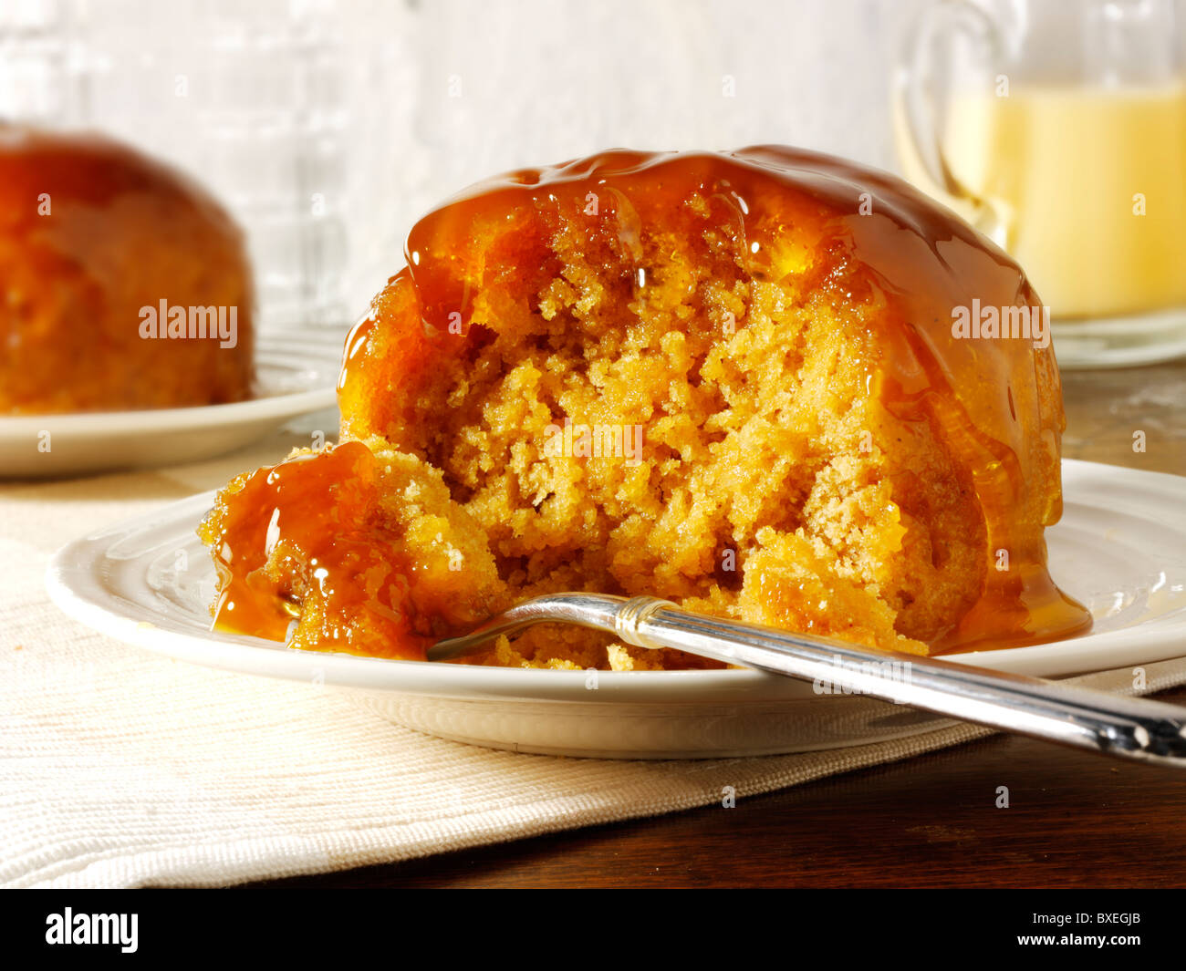 Steamed raspberry sponge and custard Stock Photo - Alamy
