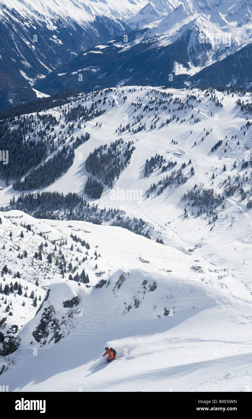 A bird's view of a free skier skiing in deep powder snow in Zillertall ...