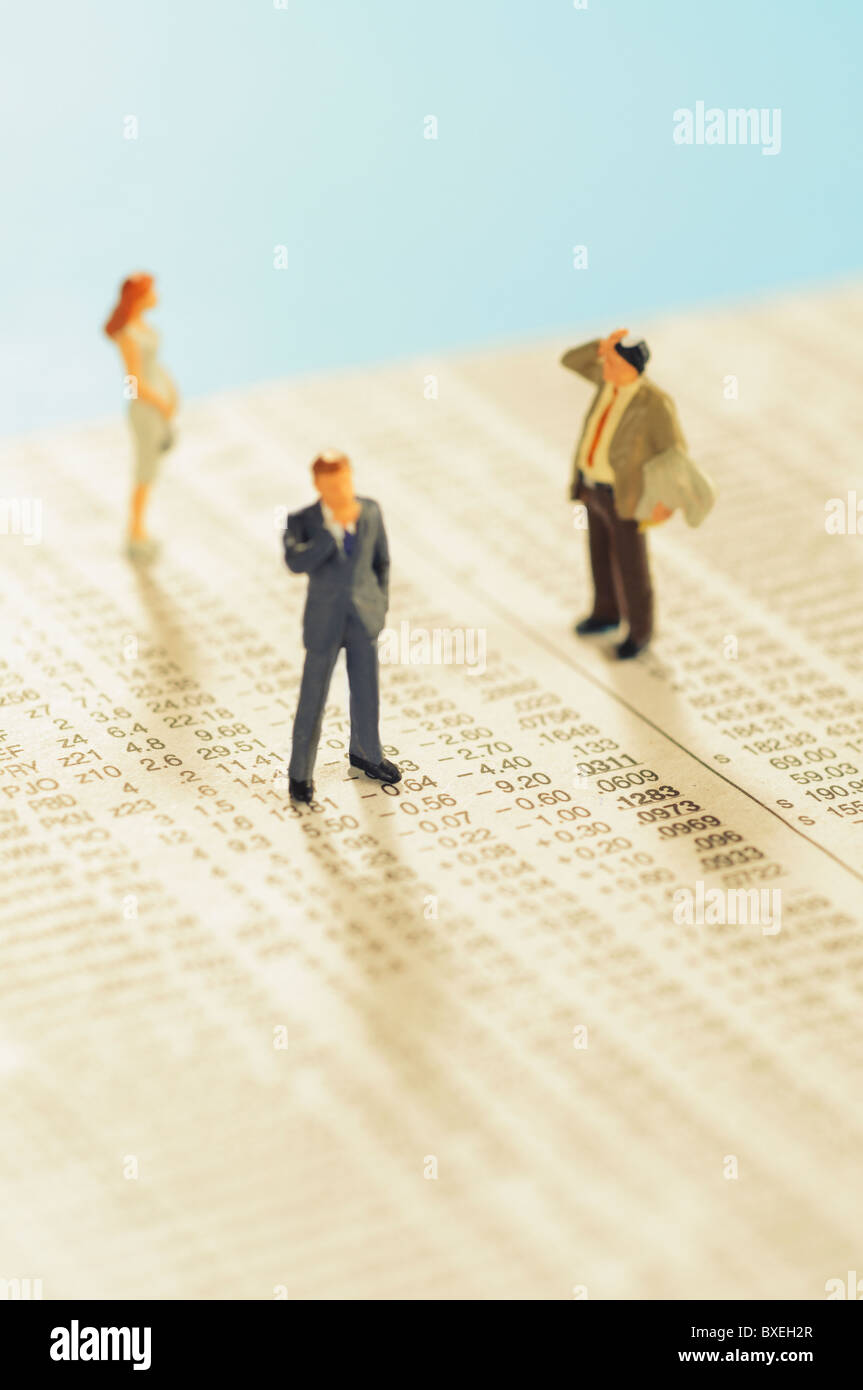 Figurines of people standing on stock chart Stock Photo - Alamy