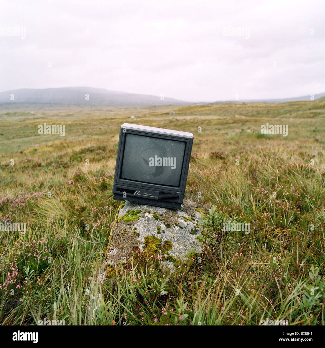 Abandoned 14" portable television set placed on a rock in the Scottish ...