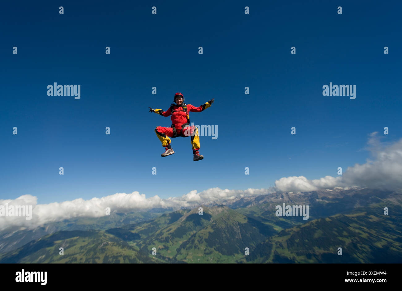 Girl is training sit flight position in freefall with 120 MPH over a ...
