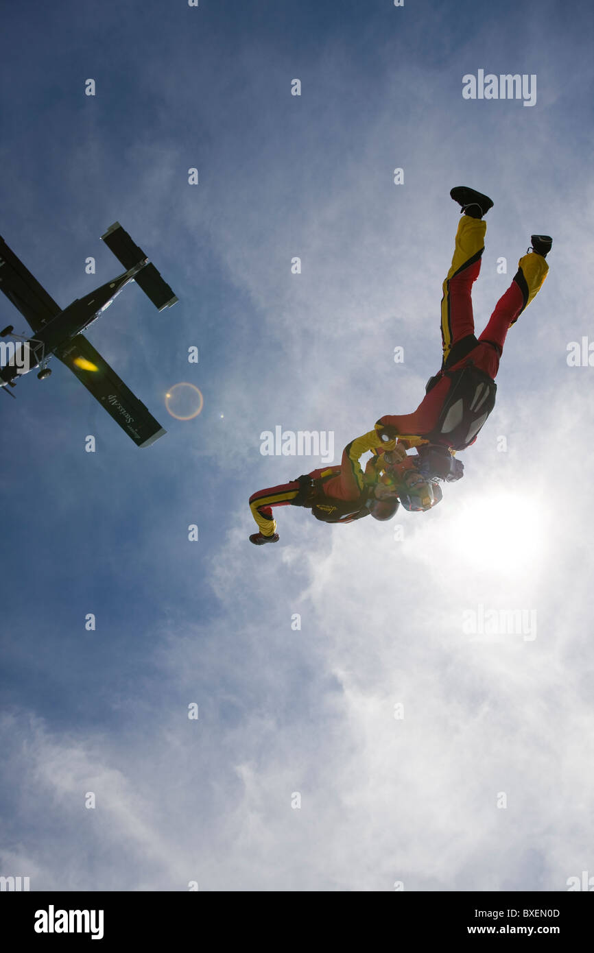 Freefly skydiving team is training formation head down flying out of an ...